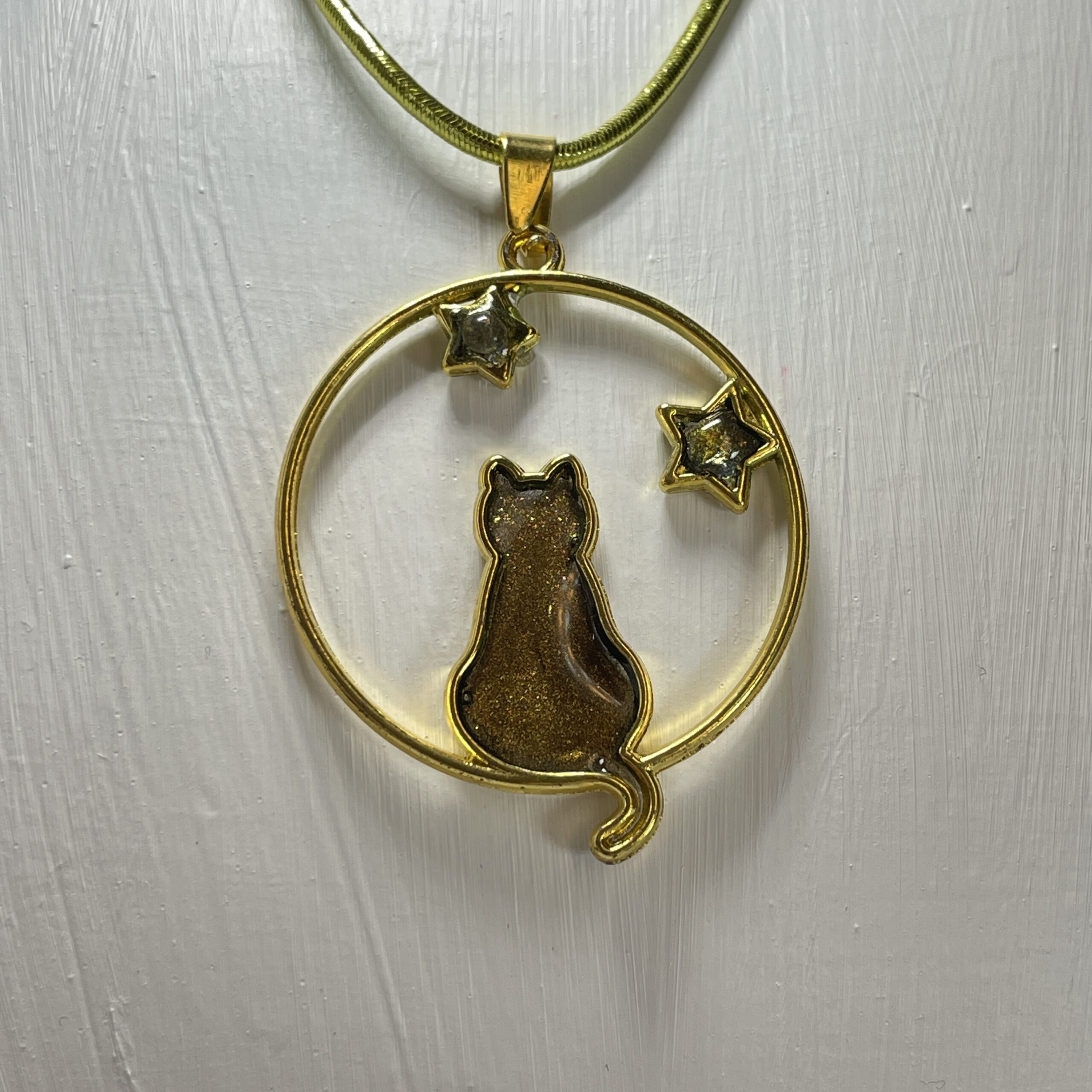 Jewellery: brown and gold pendant featuring cat and stars - Tauranga ...